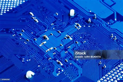 コンピュータマザーボードの青い回路基板の背景電子コンピュータハードウェア技術統合通信プロセッサ情報エンジニアリングコンポーネント青色