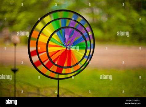Colorful Triple Pinwheel Spinning In The Wind Round Pinwheel With