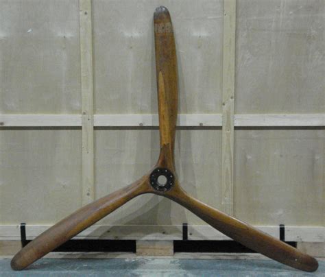 Bonhams Cars A Three Bladed Wooden Aircraft Propeller