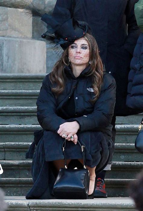 Liz Hurley Dons Huge Black Fascinator As She Films The Royals In London