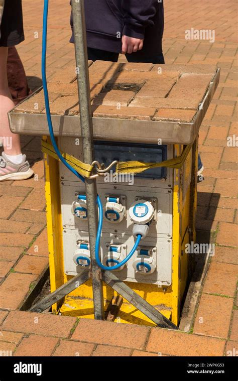Pop Up Raising Rising Riser Power Supply In A Public Space Situated In A Pedestrianised