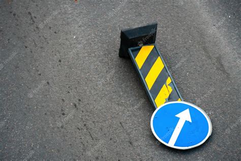 Premium Photo A Road Sign Indicating The Need To Bypass An Obstacle