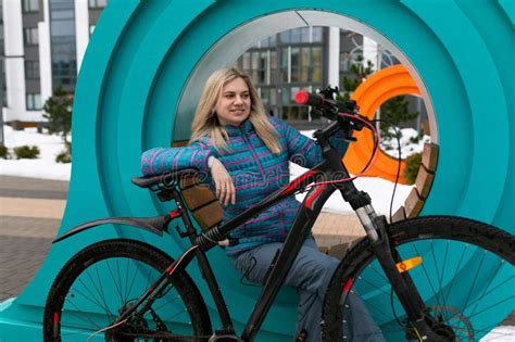 A Sporty Woman Likes To Spend An Active Day Off Riding A Bike Stock