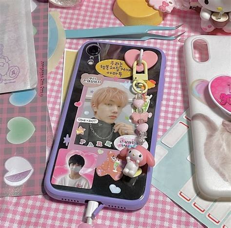 A Cell Phone Sitting On Top Of A Pink Table