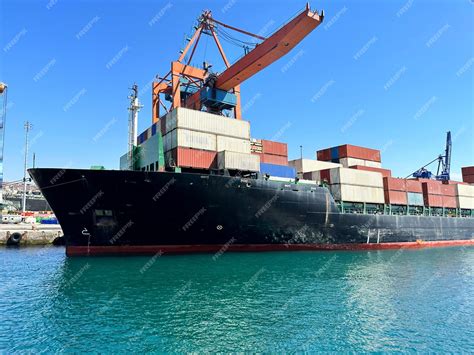 Premium Photo Marine Cargo Ship In The Port Unloading Containers