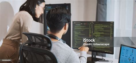 Young Adult Asian Male Female Software Developer Coding Program On Desktop Computer Man Woman