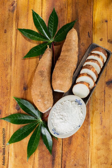 Pile Of Cassava Cassava And Cassava Flour On A Background Of Rustic Wood Manihot Esculenta