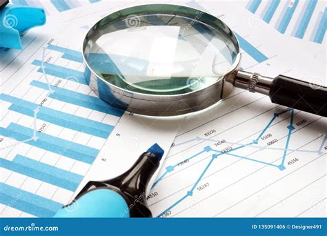 Magnifying Glass And Financial Documents Audit And Accounting Stock