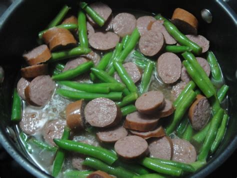 Beer Glazed Sausage And Apples A Fork In Each Hand