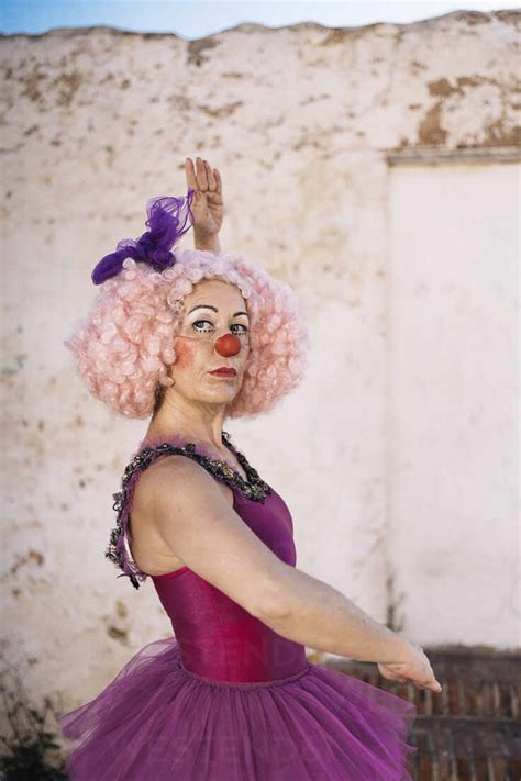 Full Body Of Mature Female Mime Artist In Tutu And Pink Wig With Bright