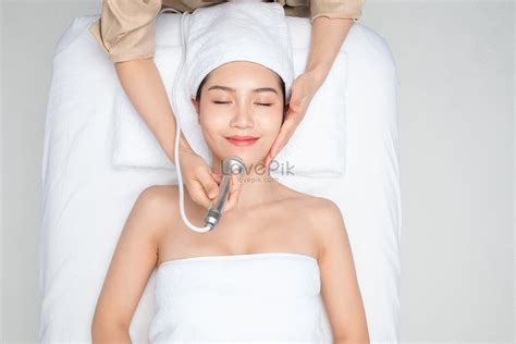 Female Lying On The Bed Doing Facial Treatment Picture And Hd Photos