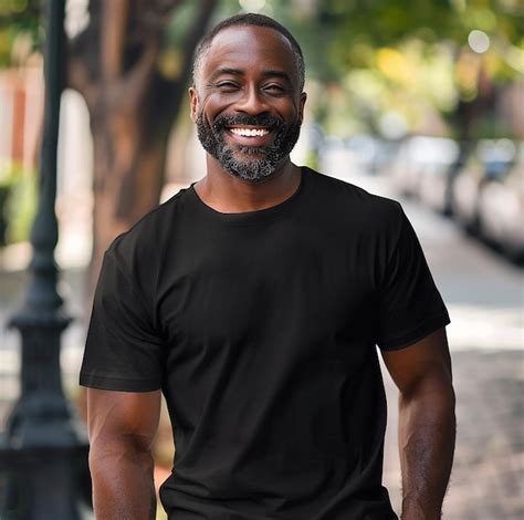 A Man With A Beard Is Smiling And Wearing A Black Shirt Premium Ai