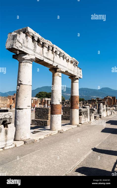 View Of Marbles Columns Sustaining Old Facade Of Roman Temple In The Ancient City Of Pompei