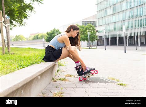 Side View Of Cool Young Female Millennial With Long Brown Hair In