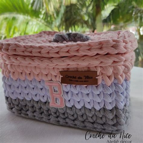 A Crocheted Blanket With A Tag On It