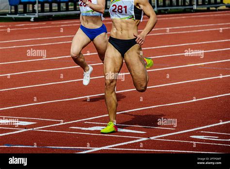 Female Runner Athlete Running Finish Line Sprint Race Track Stadium