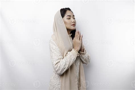 Religious Beautiful Asian Muslim Girl Wearing A Headscarf Praying To