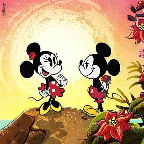 Two Mickey Mouses Standing Next To Each Other In Front Of Flowers And