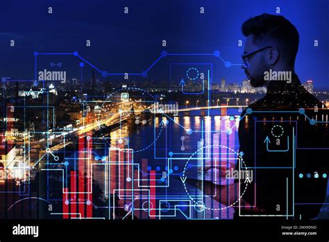 Multiple Exposure Of Businessman Graph And Night Cityscape Stock Photo