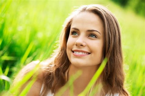 Premium Photo Pretty Woman Sitting In Grass On Field