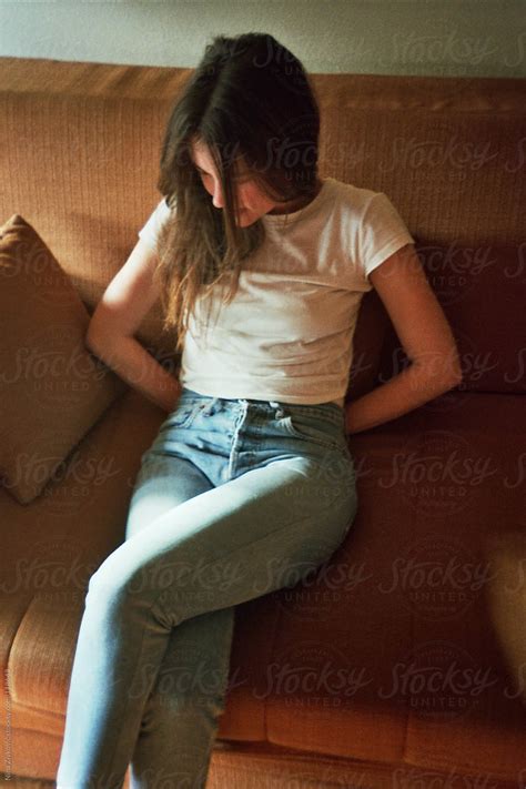 A Girl Sitting On The Couch By Stocksy Contributor Nina Zivkovic