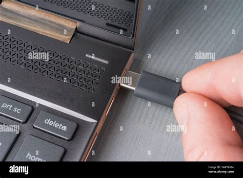 Closeup Of Usb Type C Grey Cable Being Connected To The Laptop Computer Stock Photo Alamy