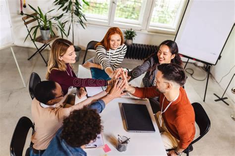 Businesspeople Stacking Their Hands On Top Of Each Other Stock Image