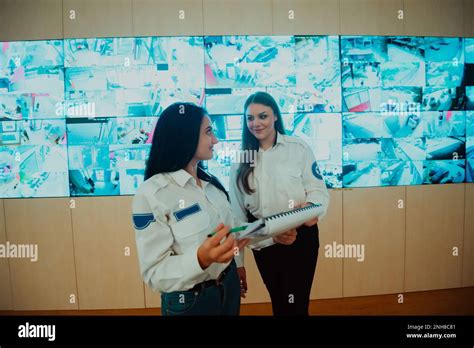Group Portrait Of Female Security Operator While Working In A Data System Control Room Offices