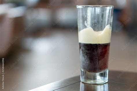 Selective Focus A Half Of Glass Frothy Sparkling Nitro Cold Brew Coffee