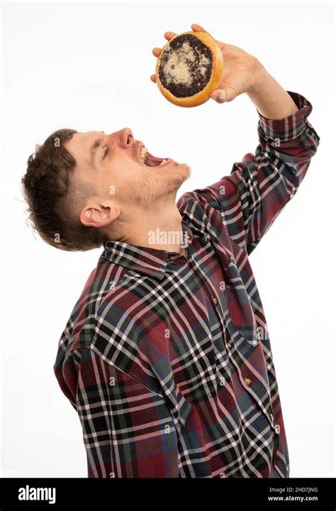 Young Handsome Tall Slim White Man With Brown Hair About To Eat Kolach