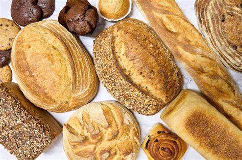 Premium Photo Different Types Of Bread And Artisan Pastries On White Marble