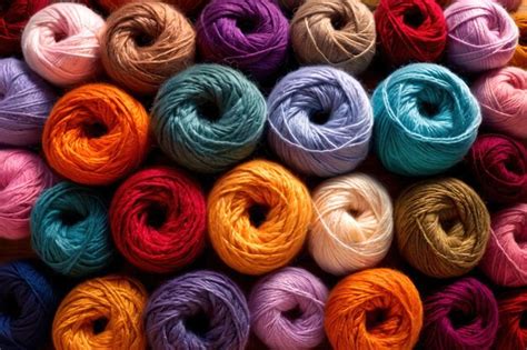 Colorful Assorted Variety Of Balls Of Thick Knitting Yarn Background