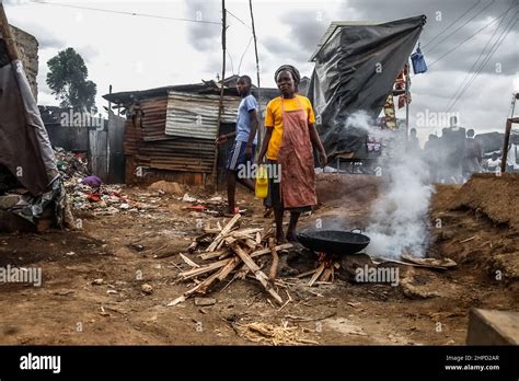 A Woman Takes A Posture By Her Local Street Business In Kibera Slums