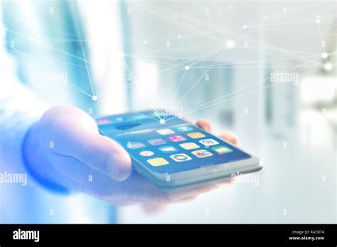 View Of A Hand Holding Smartphone With Operating System Screen And