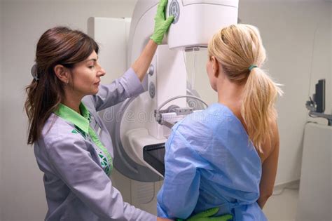 Experienced Radiologic Technologist Preparing Female For Mammogram Stock Image Image Of