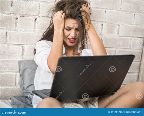 Surprised Worried Woman Looking In Screen Of Laptop Computer Getting Bad Information Stock Photo