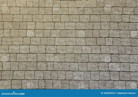 Gray Color Paving Slabs In The Pedestrian Street Sidewalk Rough Cobblestone Pattern With Many