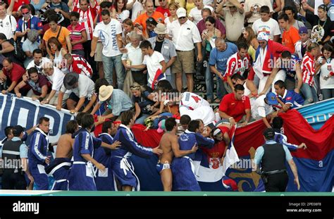 The Serbia And Montenegro Water Polo Team Catches Fans As A Railing