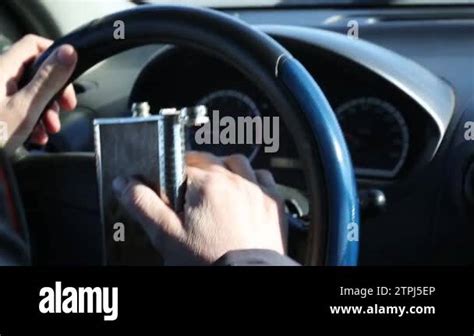 Alcohol Is Driving A Car While Driving The Hand Of A Drunk Driver Holds