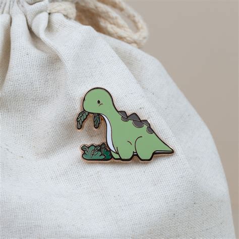 Bronti Snacking Enamel Pin Brontosaurus Snacking Enamel Pin Bellzi