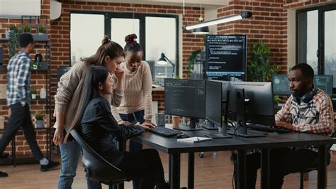 Premium Photo Mixed Team Of Software Engineers Brainstorming Ideas