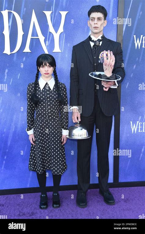 Performers Wearing Wednesday And Lurch Costumes Attend A Photo Call