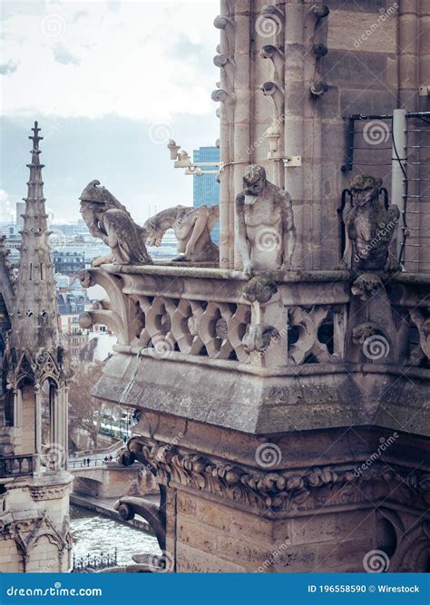 Beautiful Vertical Shot Of The Gargoyles On Top Of The Notre Dame