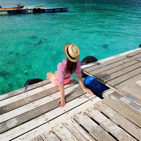Woman at beach jetty stock image. Image of pier, beach - 27400481