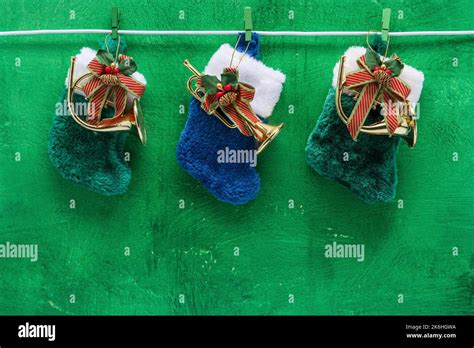 Christmas Theme With Furry Stockings Hung On A Clothesline With Brass