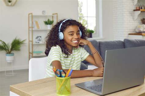 Girl Communicates With Distant Relatives Using Digital Communication Via Internet Stock Image