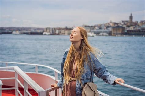 Happy Woman Enjoying The Sea From Ferry Boat Crossing Bosphorus In
