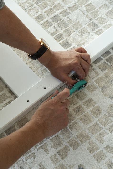 Close Up Of A Worker Assembling A Wooden Bed Stock Image Image Of