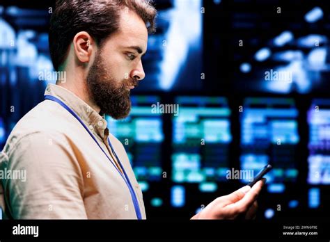 Expert Using Tablet To Set Up Supercomputer Farm Infrastructure Advanced Firewalls And Intrusion