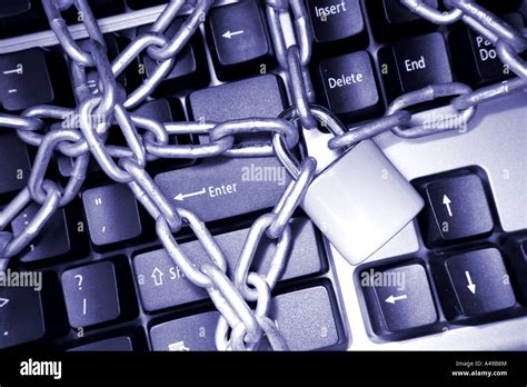 Padlock And Chain Around Computer Keyboard Stock Photo Alamy